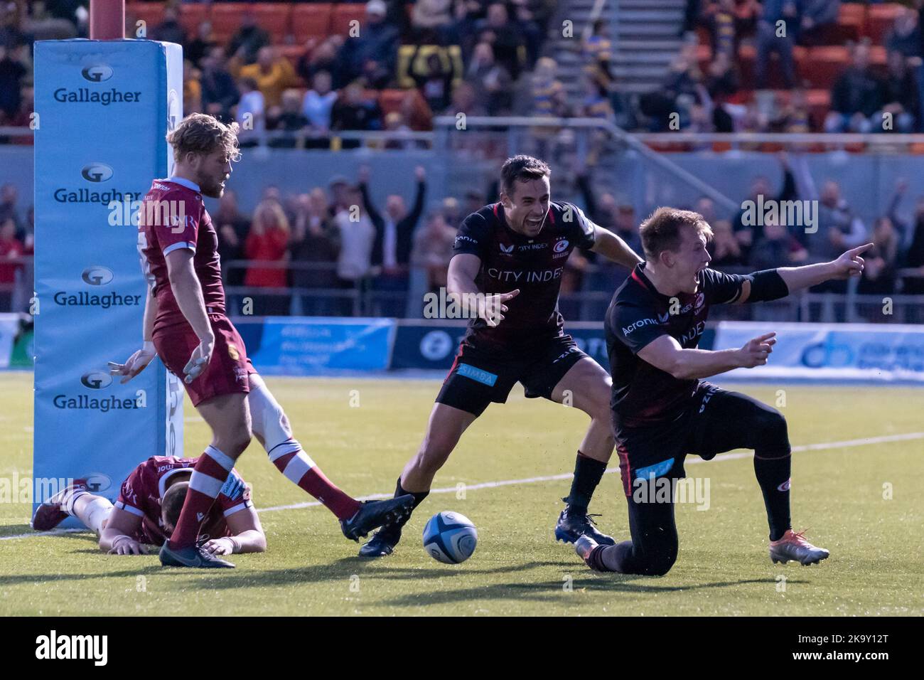 Nick Tompkins #12 of Saracens celebrates scoring a try in the last ...