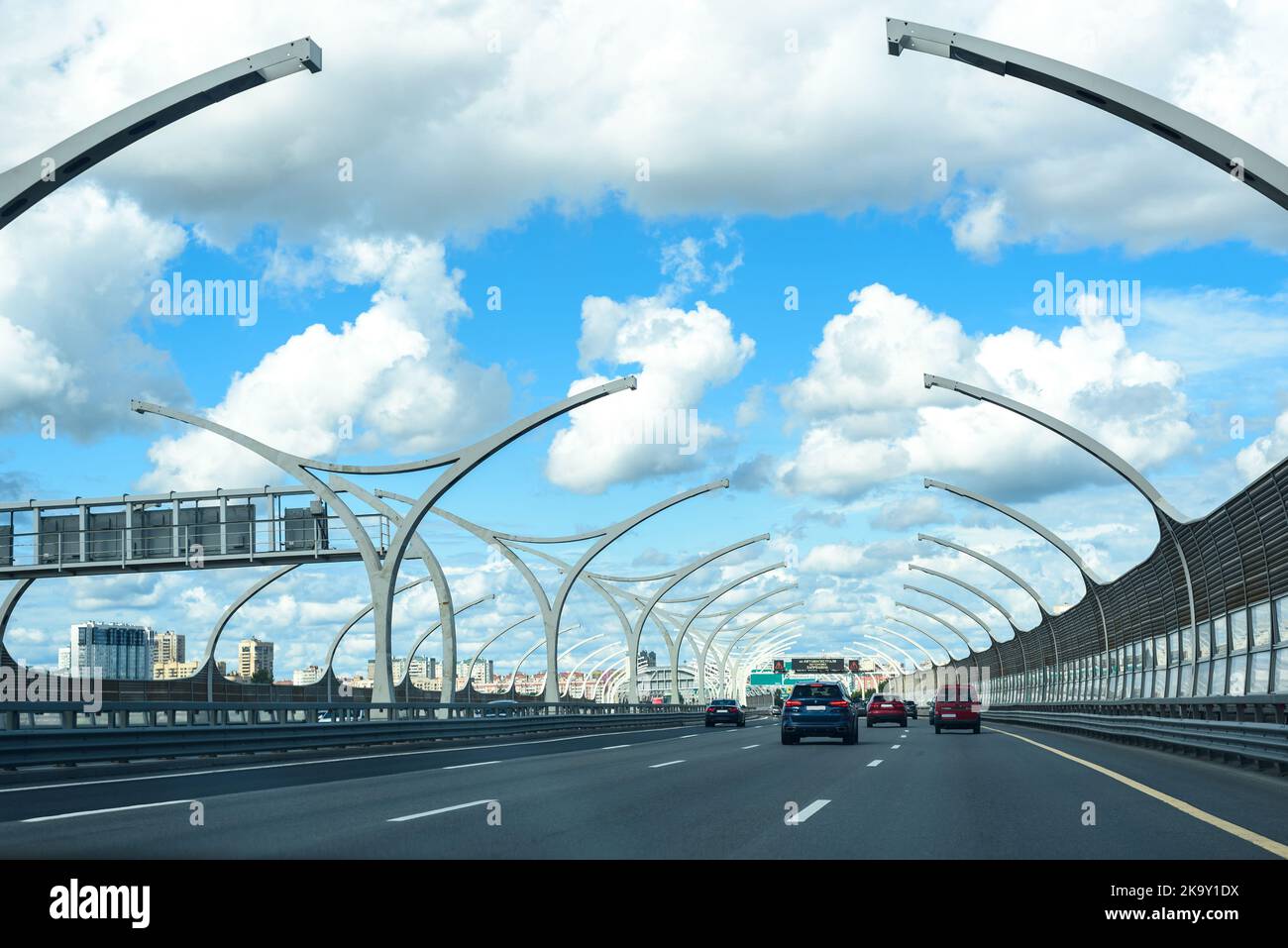 Traffic on road with stylish street lights under blue sky Stock Photo ...