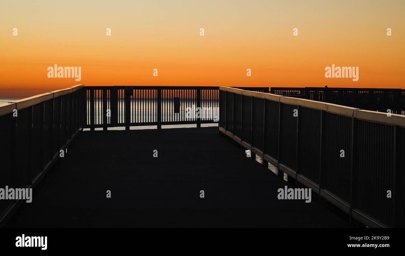 Metal railing silhouette with sunrise colored sky with copy space Stock ...
