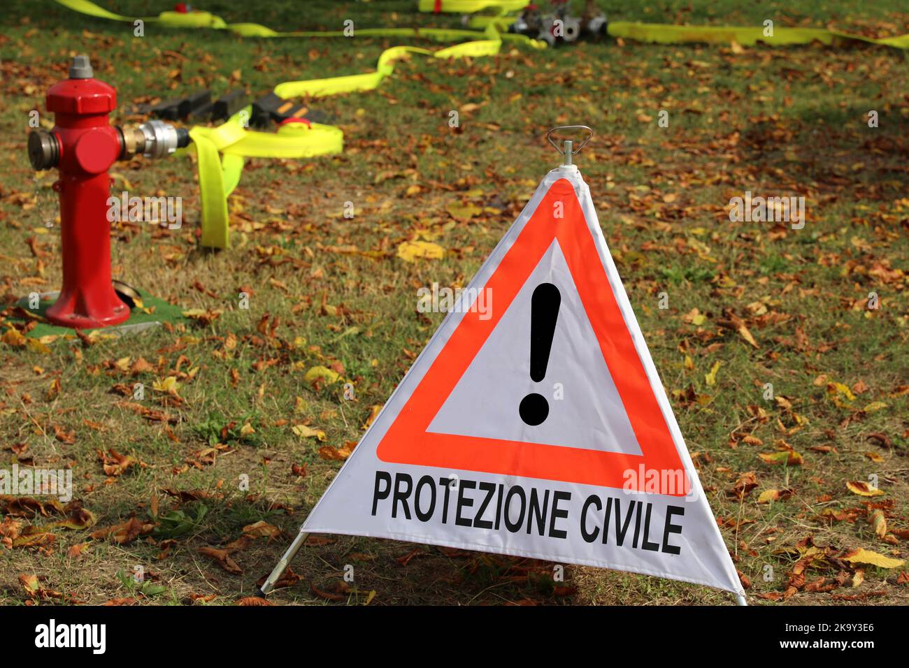 big triangle with exclamation mark and text in Italian which means ...