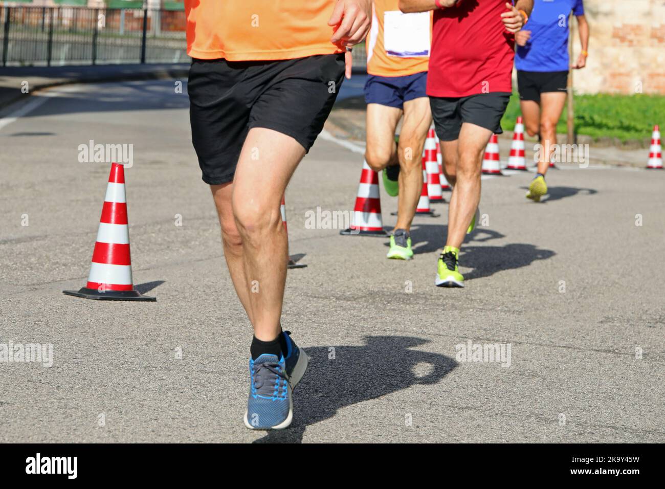 athletic runner with long muscular legs during the foot race in the ...