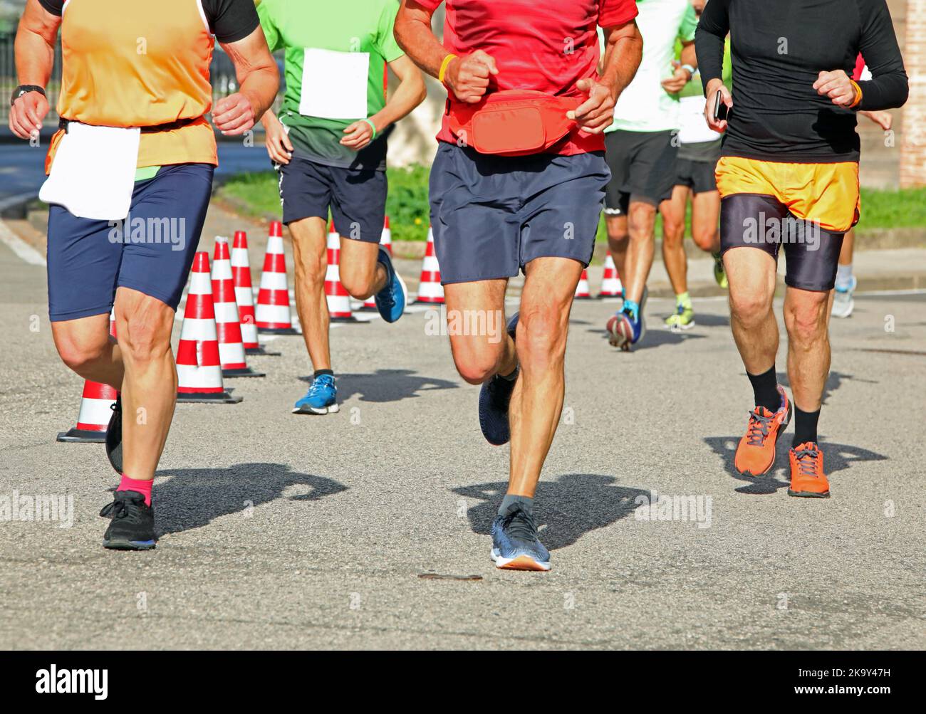 runners with muscular legs during the foot race Stock Photo - Alamy