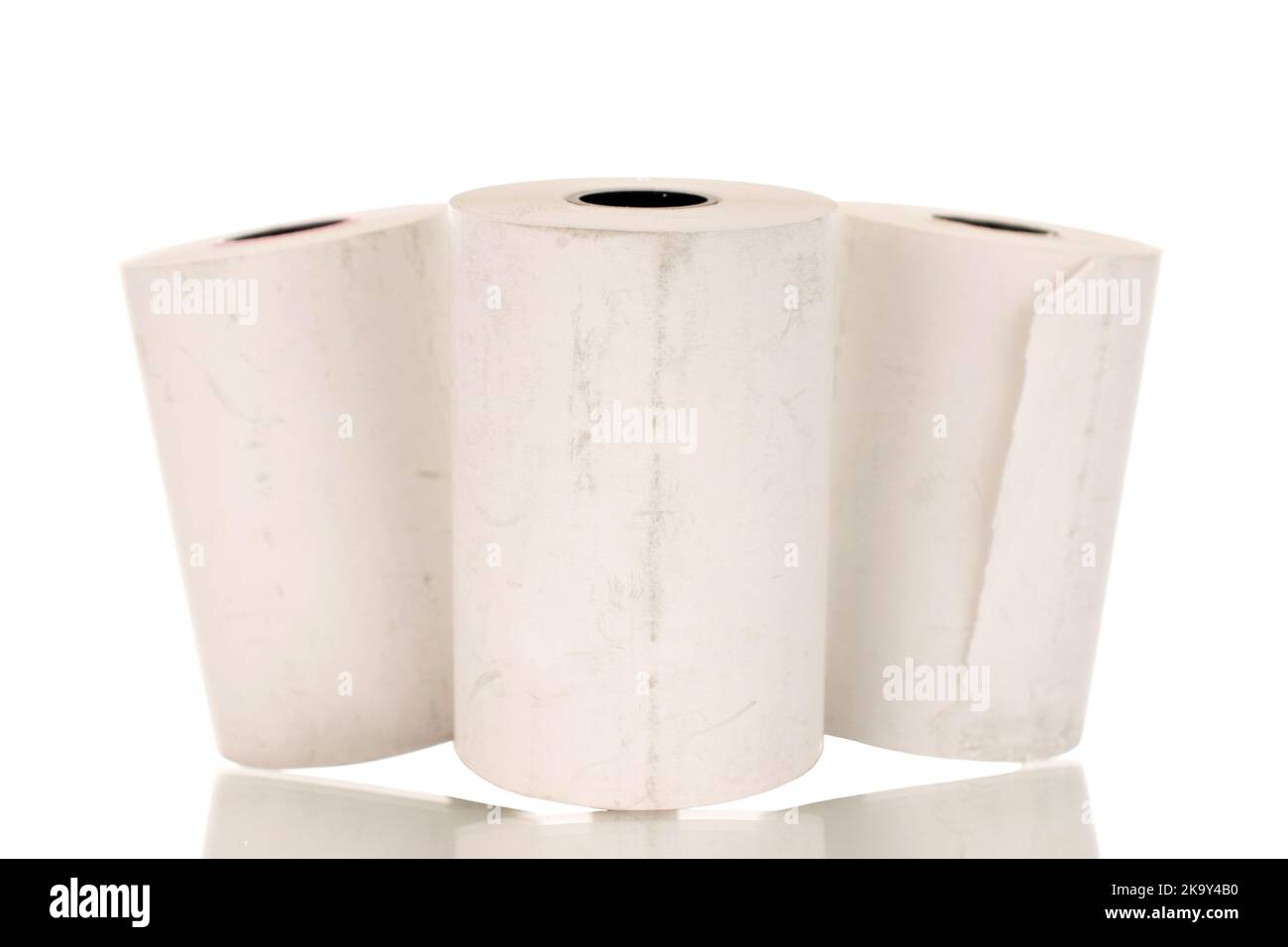Three rolls of paper cash register tape, close-up isolated on white ...