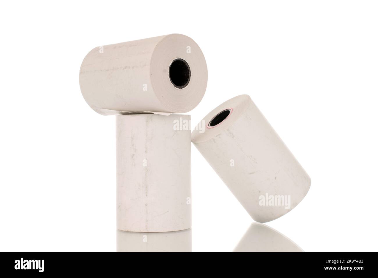 Three rolls of paper cash register tape, close-up isolated on white ...