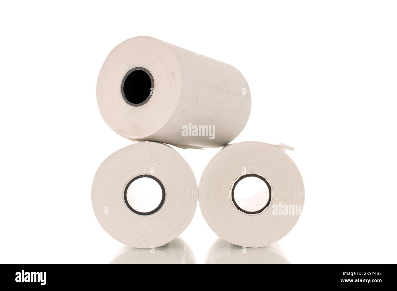 Three rolls of paper cash register tape, close-up isolated on white ...