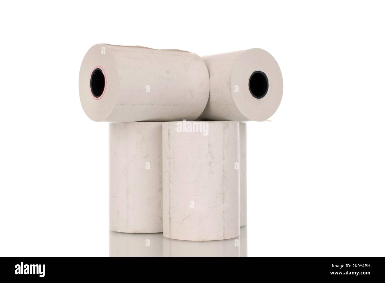 Several rolls of paper cash register tape, close-up isolated on white ...