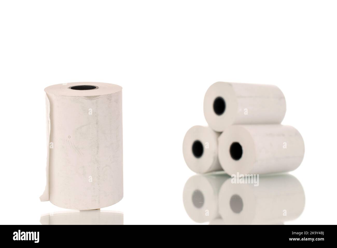 Several rolls of paper cash register tape, close-up isolated on white ...