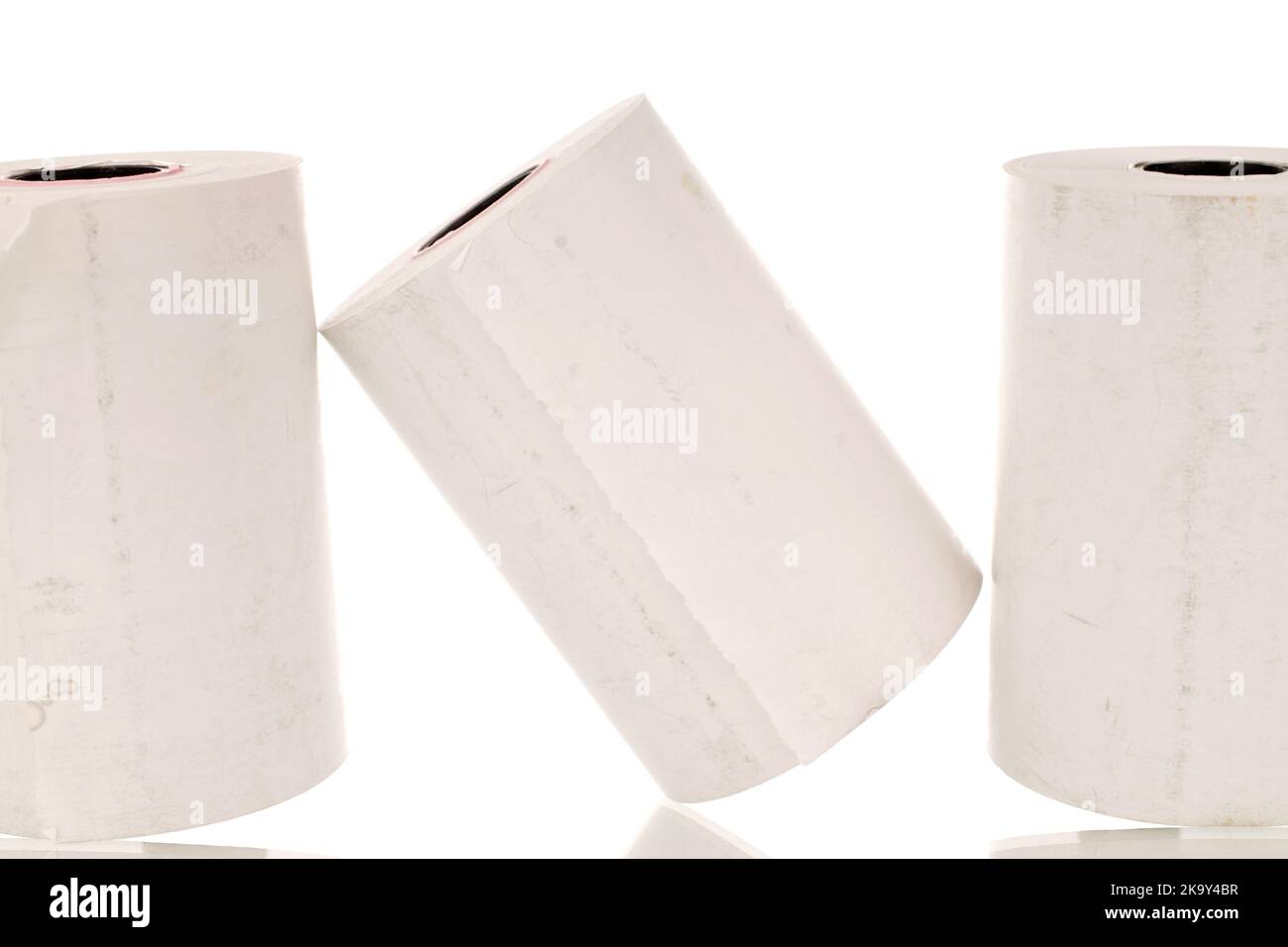 Three rolls of paper cash register tape, close-up isolated on white ...