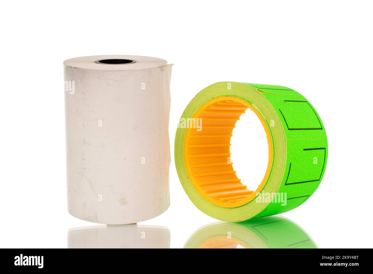 One roll of paper price tags and one roll of cash register tape, macro ...