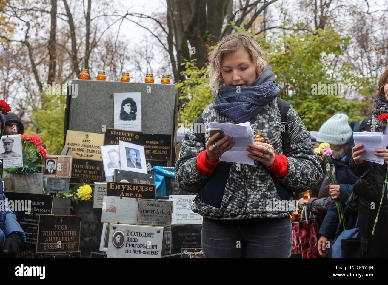 Woman Reading The Names Of Victims Near The common Grave No 1 At The woman-reading-the-names-of-victims-near-the-common-grave-no-1-at-the