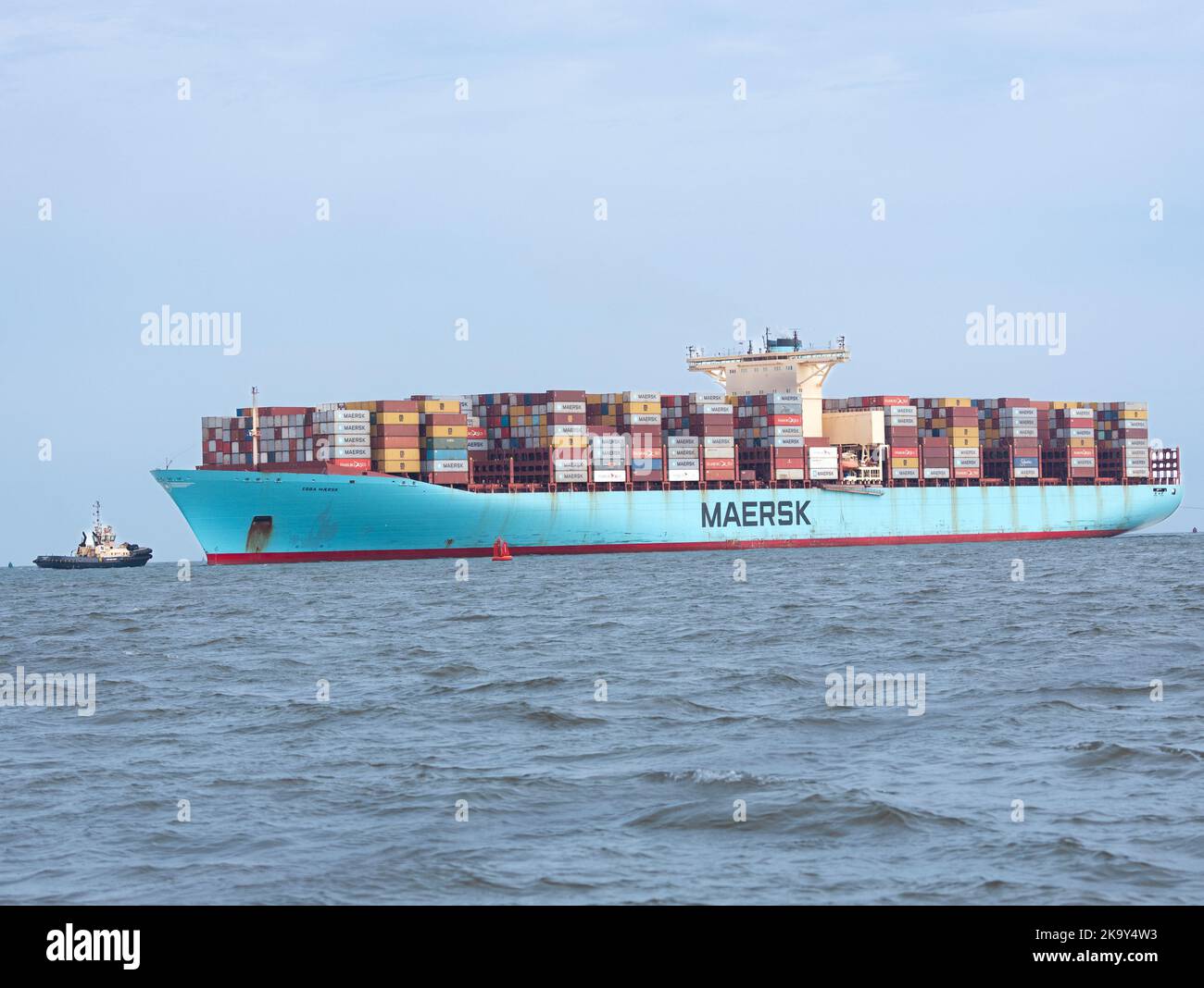 Large Ebba Maersk container ship with tug entering Felixstowe docks ...