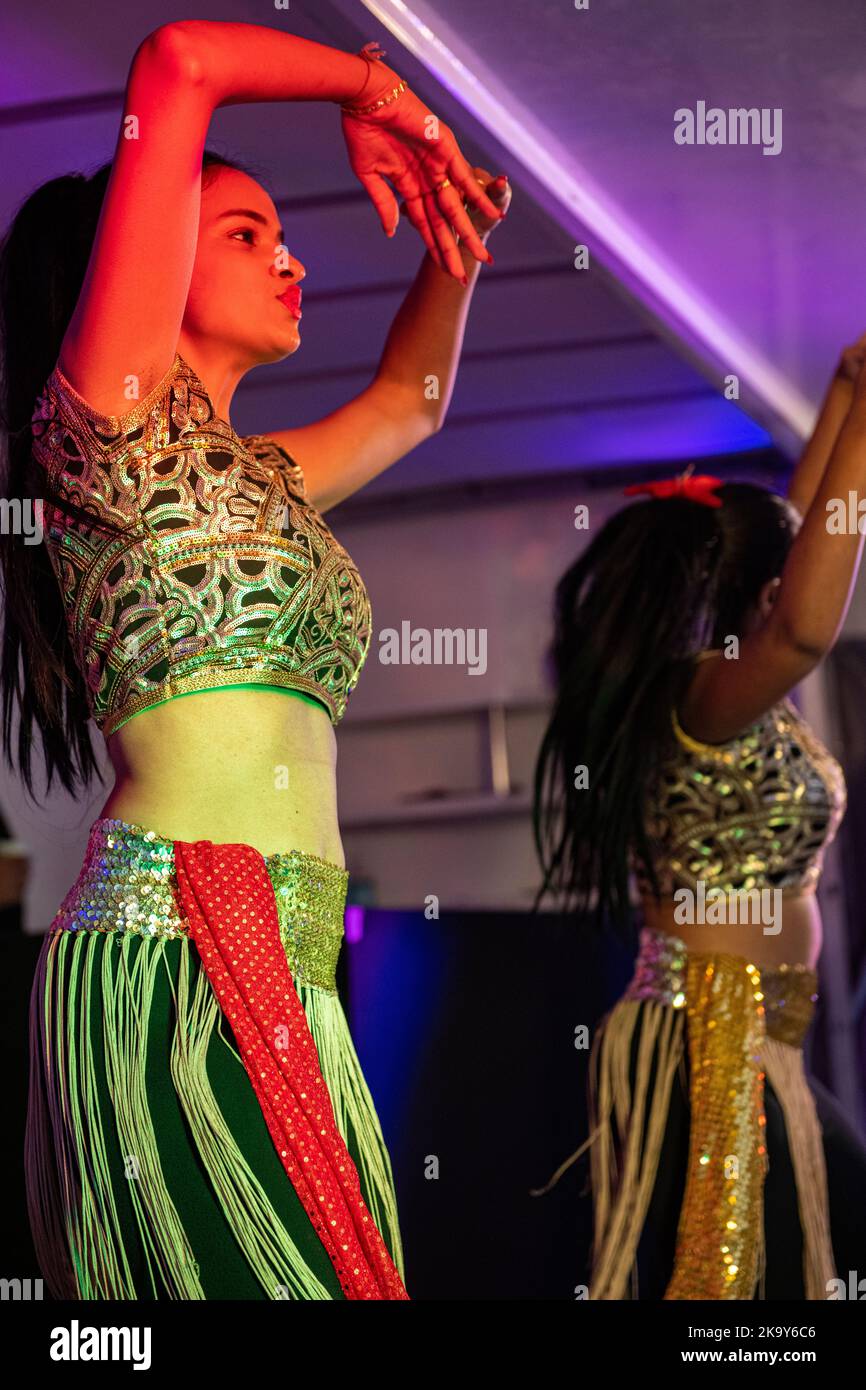 Dancers on stage in the rain for a Divali performance in Tooting ...