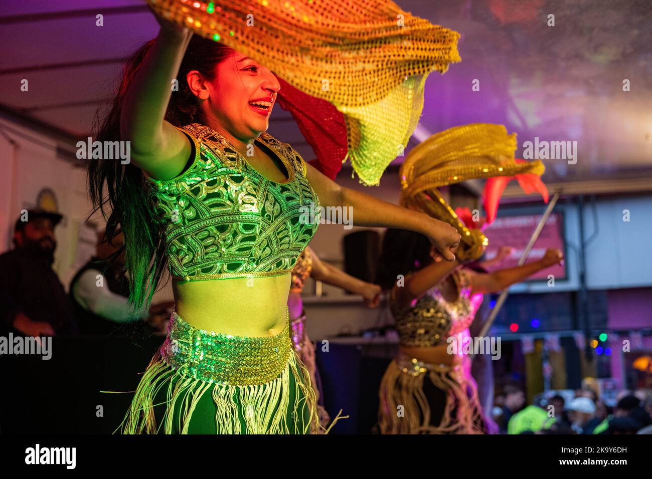 Dancers on stage in the rain for a Divali performance in Tooting ...