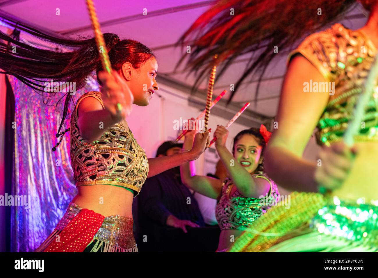 Dancers on stage in the rain for a Divali performance in Tooting ...