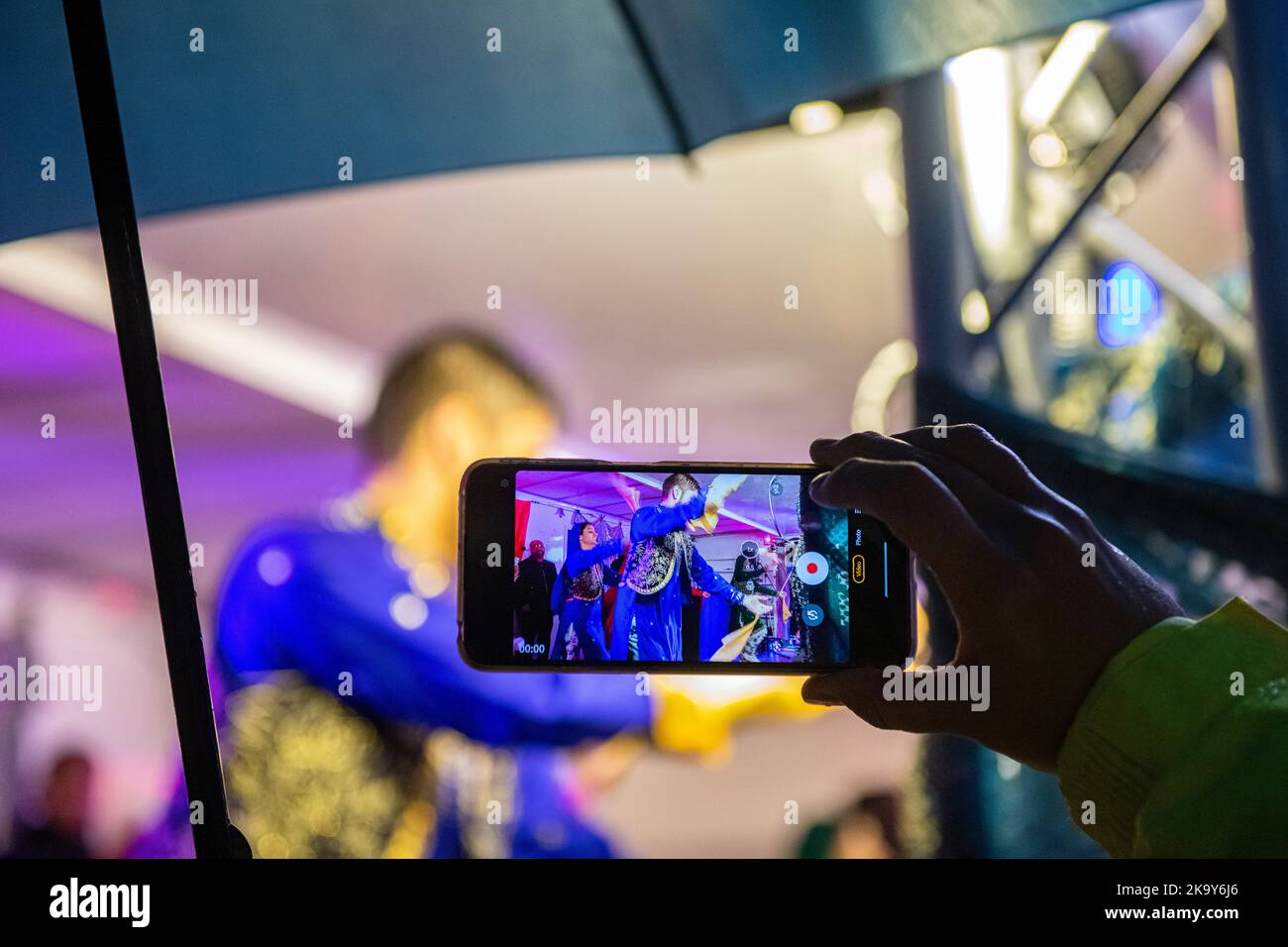 Dancers on stage in the rain for a Divali performance in Tooting ...