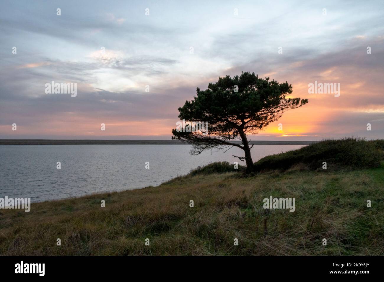 The fleet, Weymouth, Dorset, UK at sunset showing the beautiful colors ...