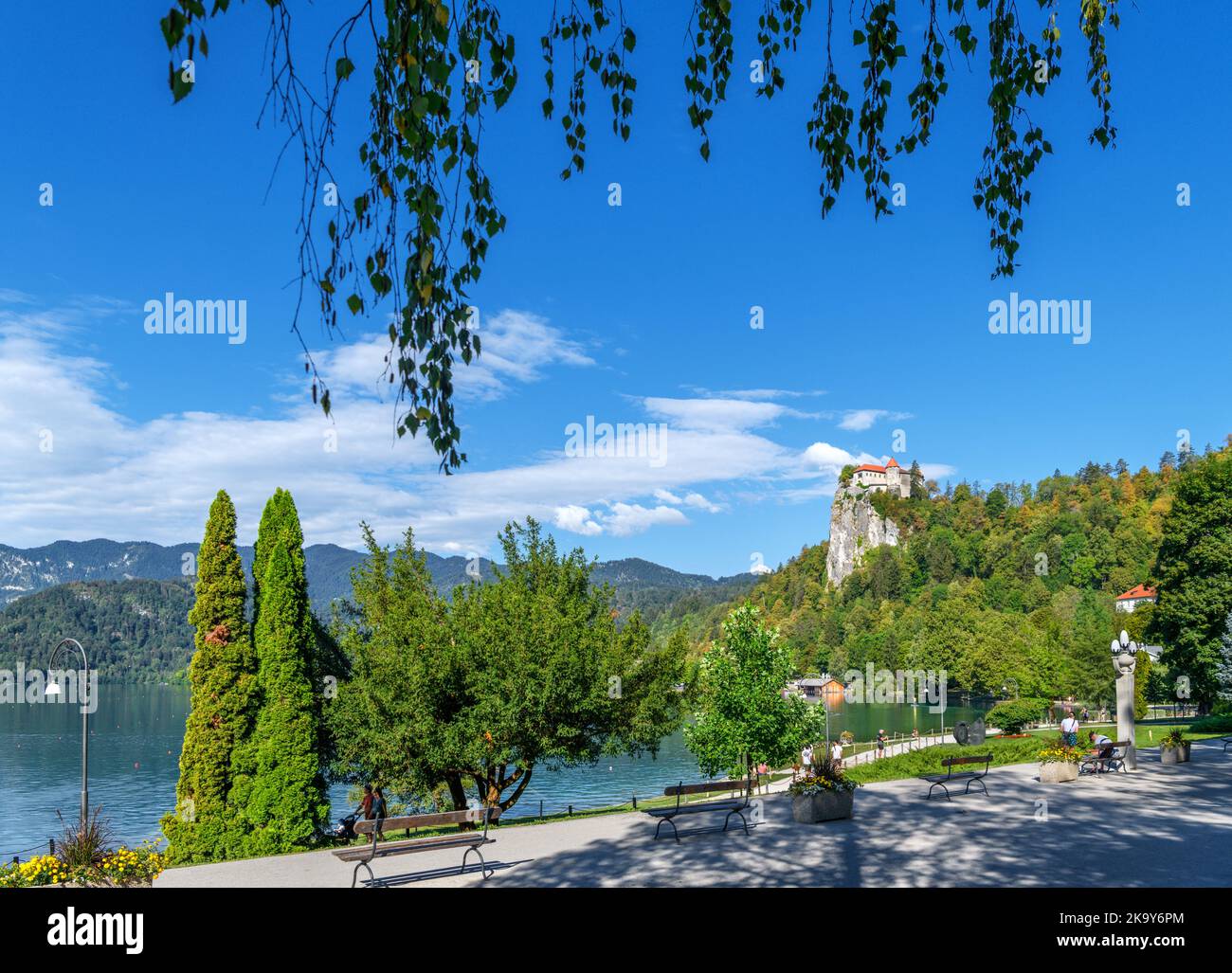 View along the lakefront towards Bled Castle, Bled village, Lake Bled ...