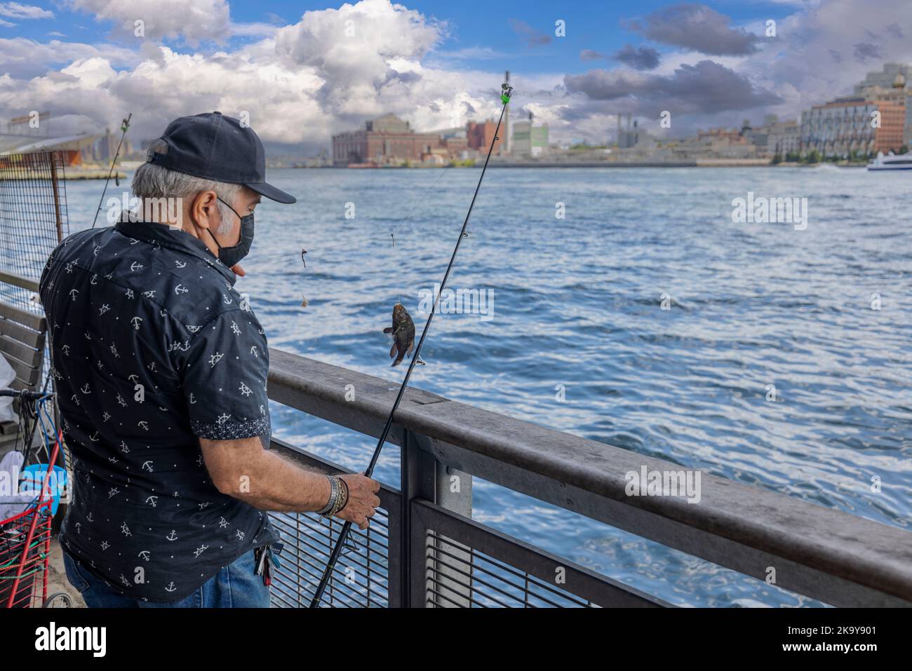 Man fishing on small bridge hi-res stock photography and images - Alamy