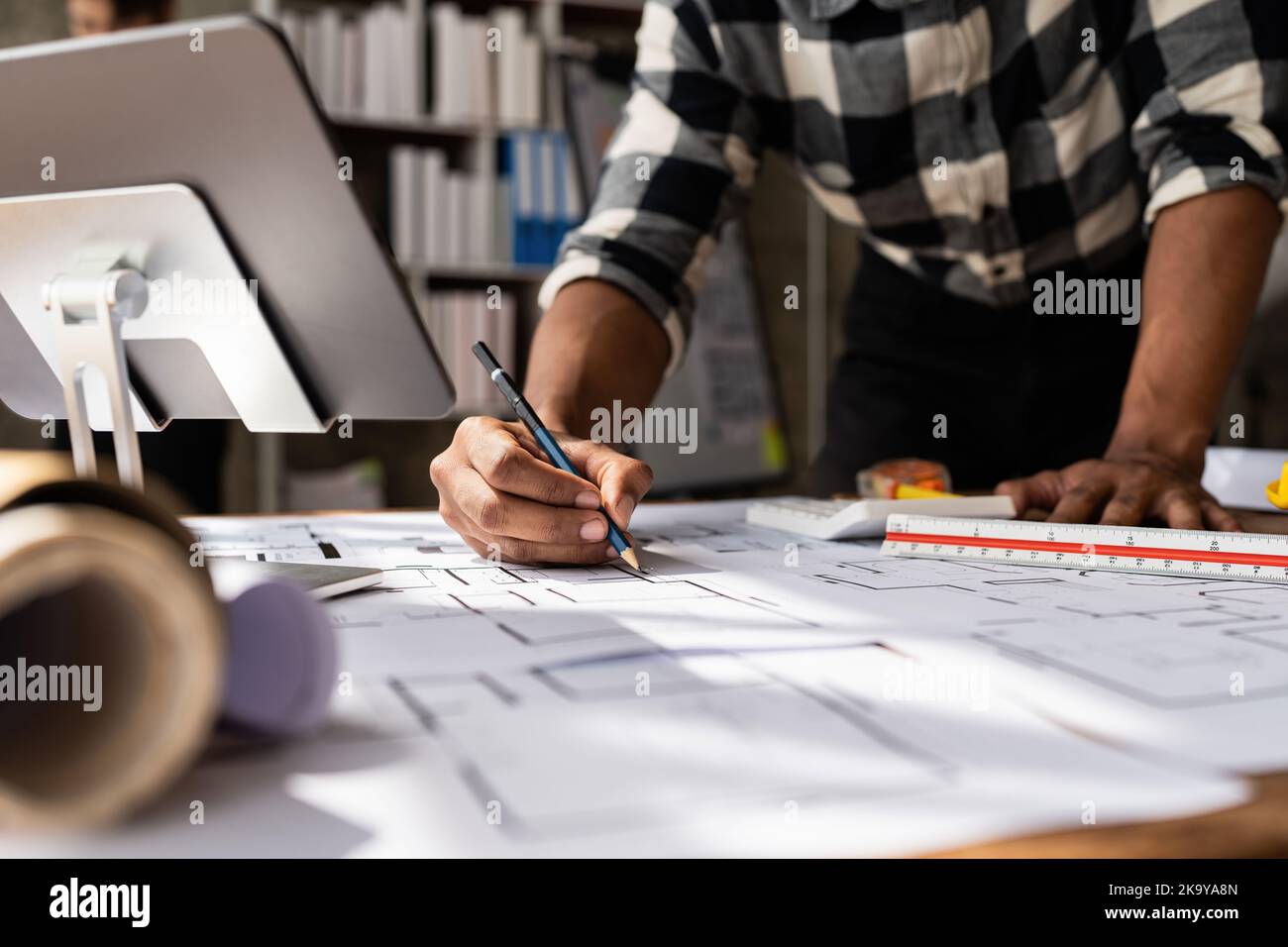 Architect man working with blueprints for architectural plan, engineer ...