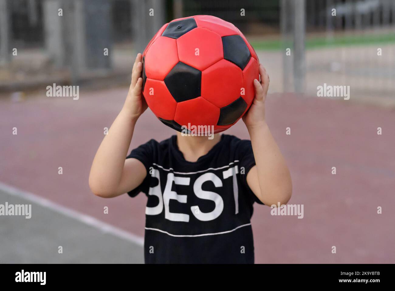 Faceless portrait of little boy with soccer ball Stock Photo - Alamy