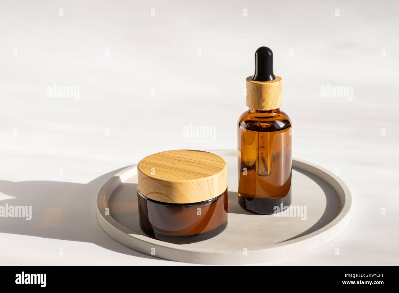 Set of empty cosmetic packaging, jar and bottle, mockup, on concrete ...