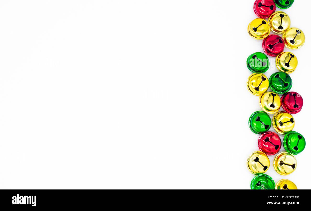 Colorful ringing Christmas bells in gold, red and green. The concept of ...