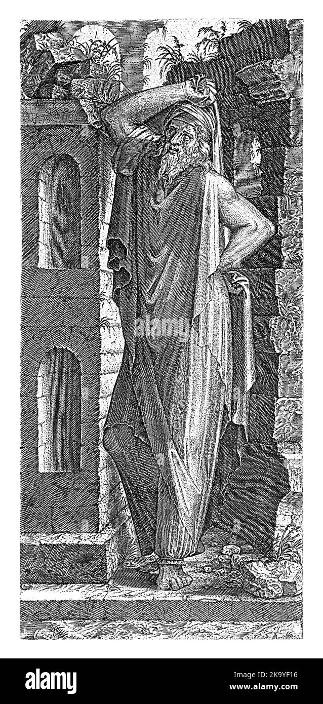 The apostle Philip standing in a niche with one hand on his side and ...