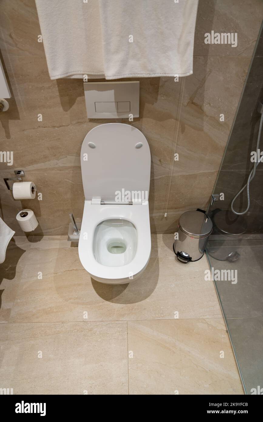 Toilet bowl with open lid and lowered toilet seat Stock Photo - Alamy