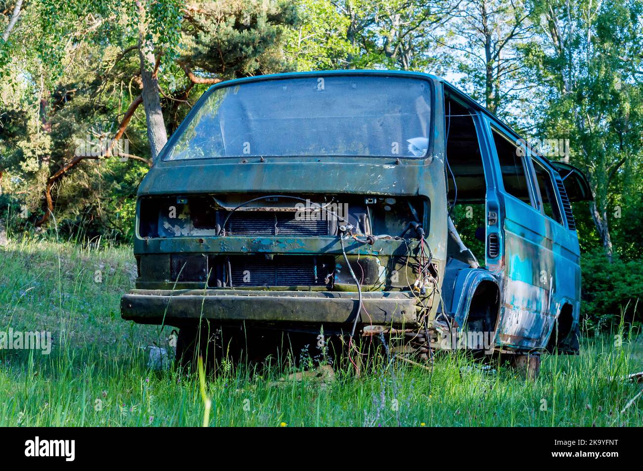 Old, damaged car. Abandoned car in the woods.Defective car. A car unfit ...