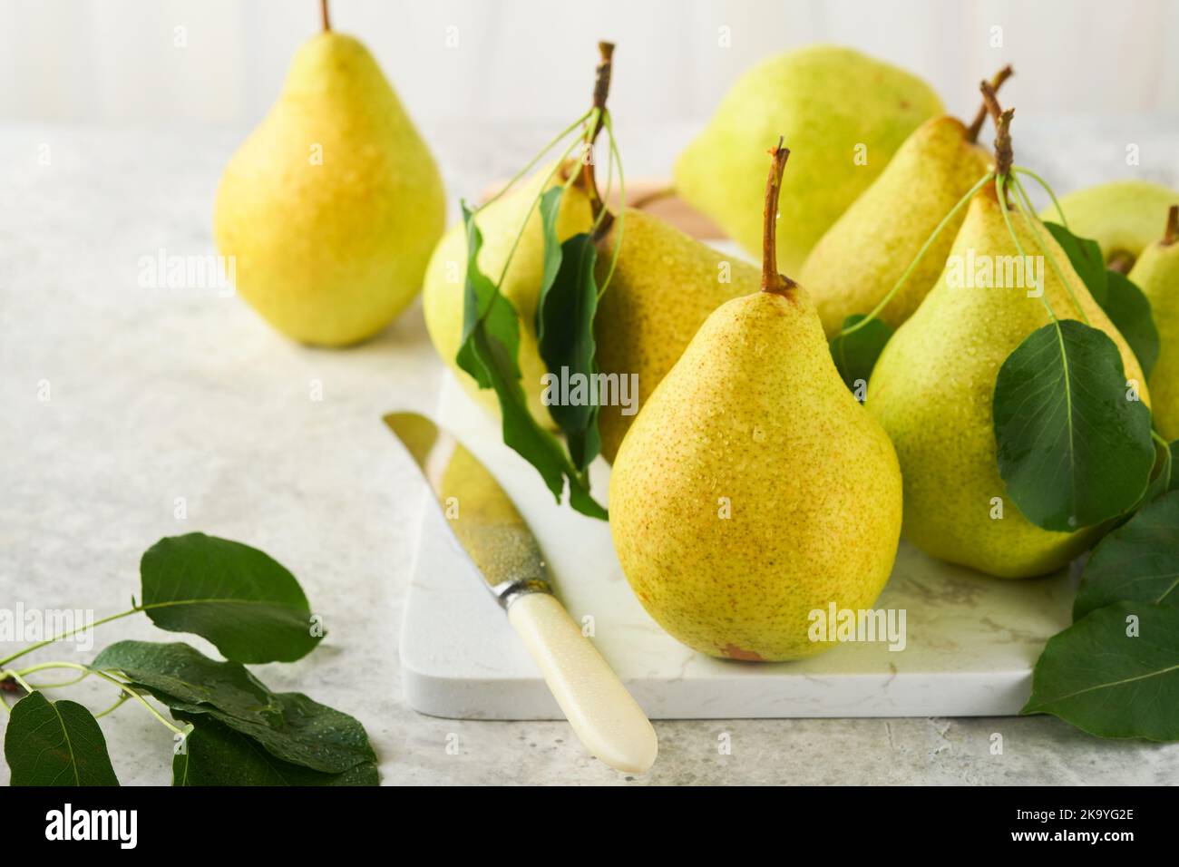 Pears. Fresh sweet organic pears with leaves on stand or plate on old ...