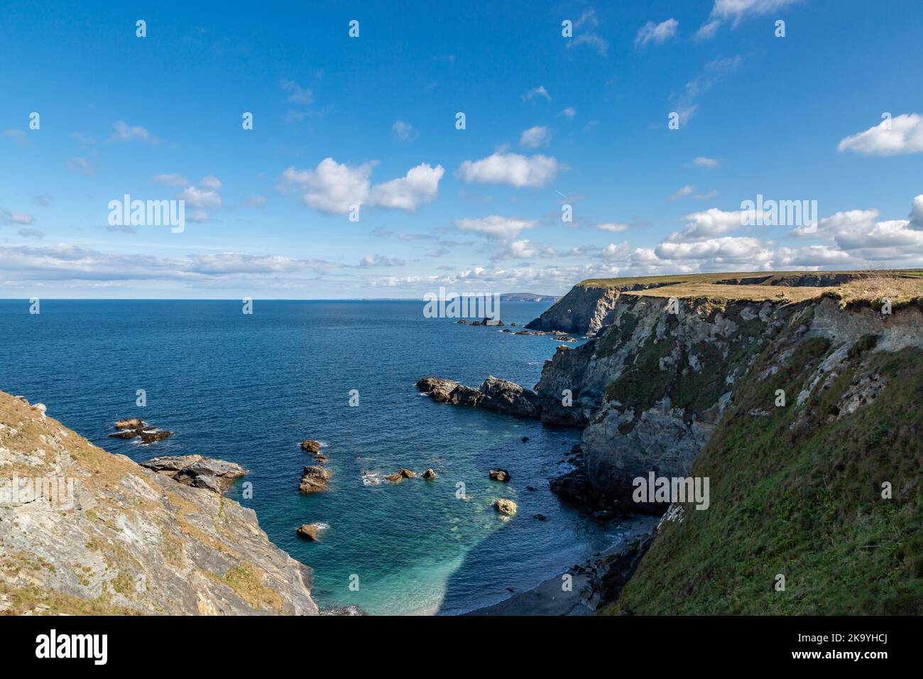 The rugged Cornish coastline at Mutton Cove near Godrevy Point, on a ...