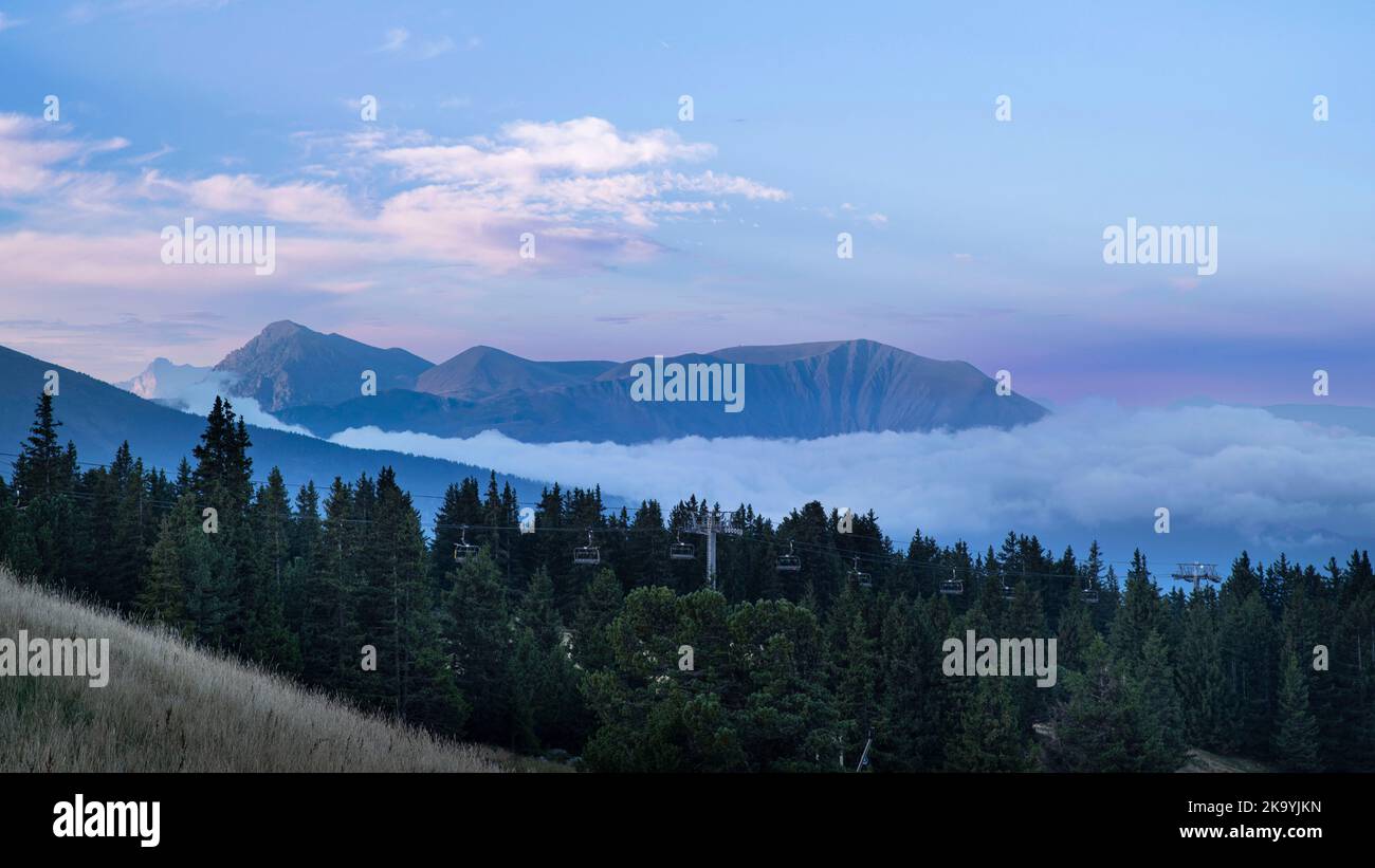 Mountain landscape with clouds in summer in Chamrousse in the Alps ...