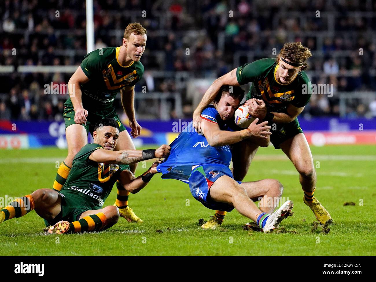 Italy's Luke Polselli is tackled by Australia's Valentine Holmes (left ...
