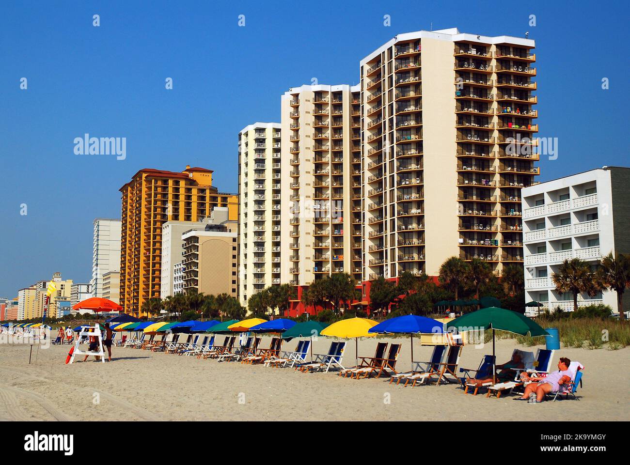 Early Morning, before the Crowds, umbrellas and seats are arranged on ...