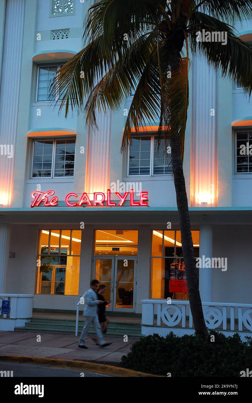 A young couple walks past the front entrance to the Art Deco The ...