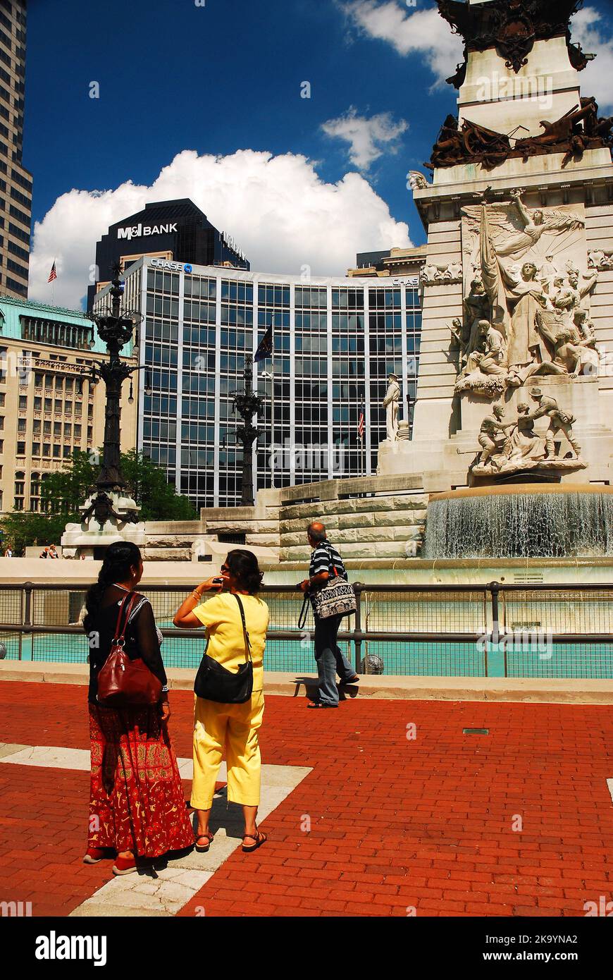 An Indiana family dressed in traditional clothes, stands at the base of ...
