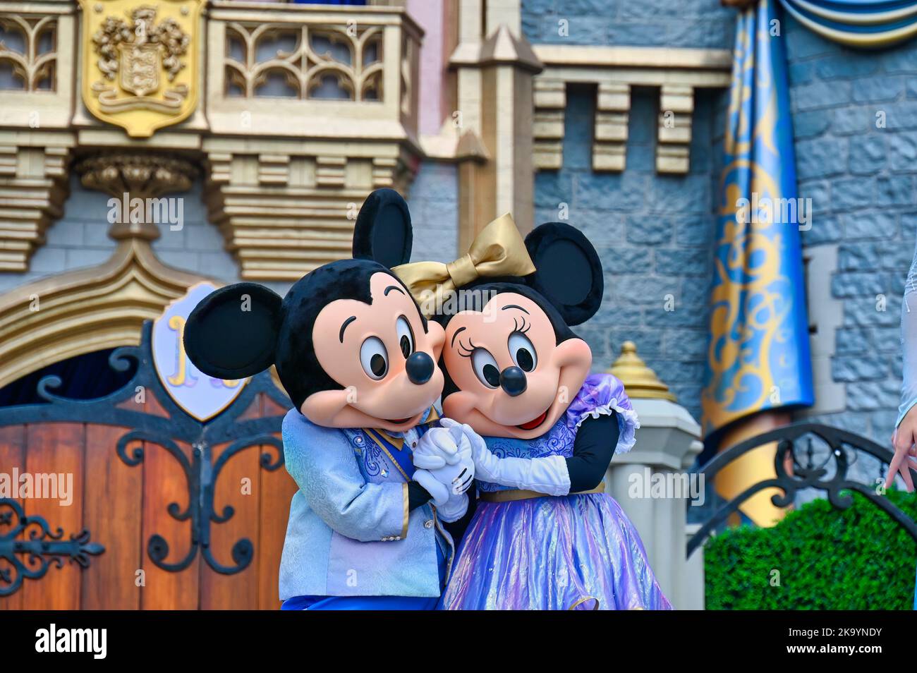 Mickey and Minnie mouse looking cute and holding hands Stock Photo - Alamy