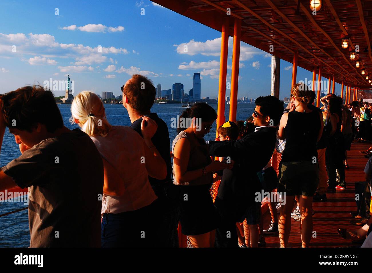 Commuters and tourist aboard the Staten Island Ferry get an excellent ...