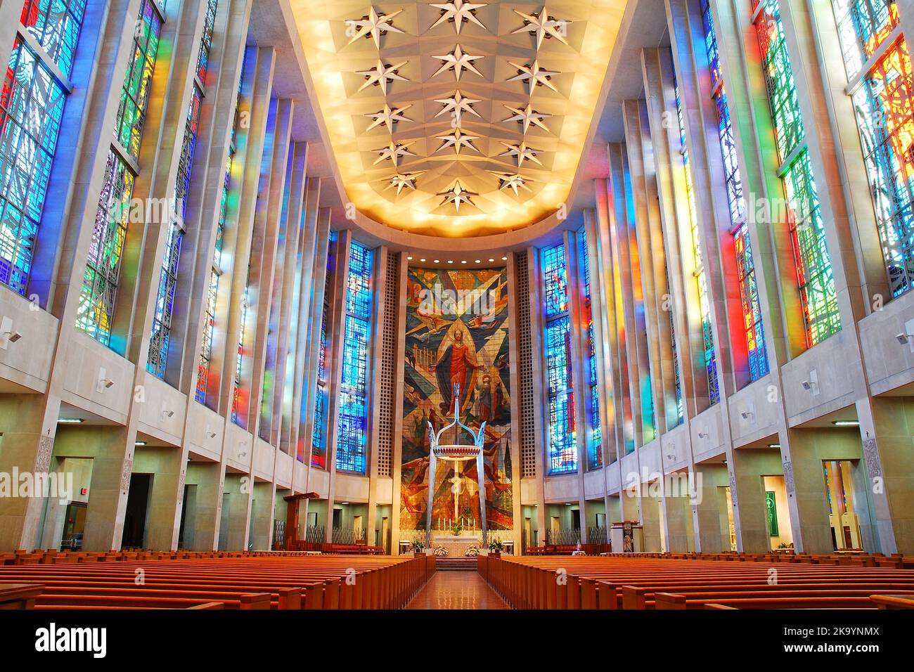 Large stained glass windows cover the side walls of St Joseph's ...