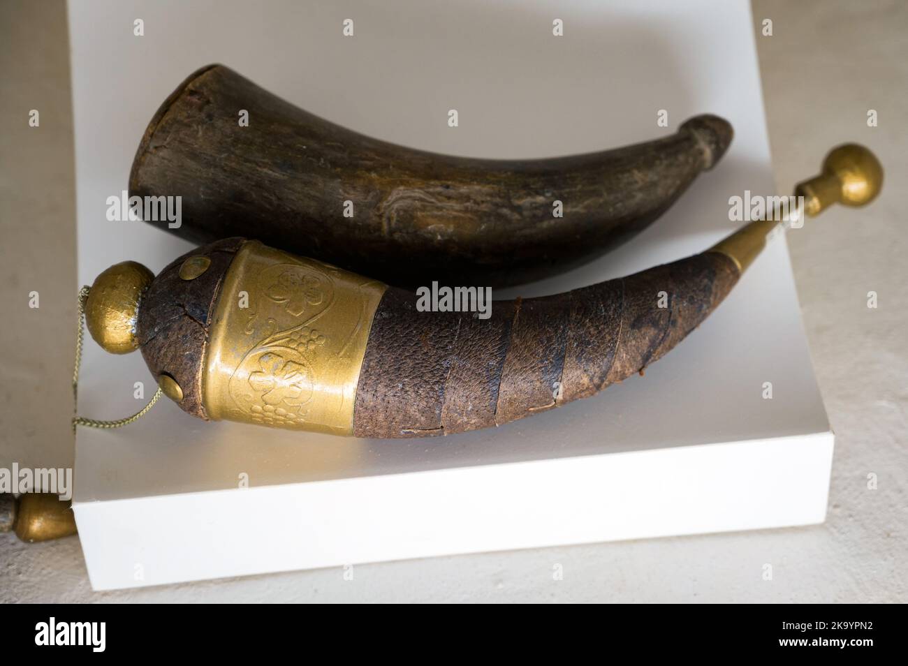 Exhibit of an old powder horn on white background, close-up photo Stock ...