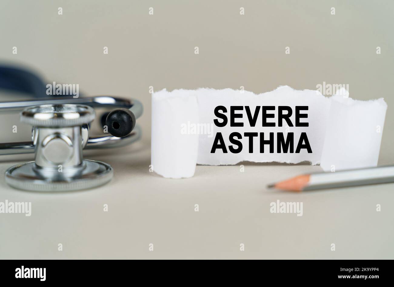 Medical concept. On a gray background, a stethoscope, a pencil and a ...