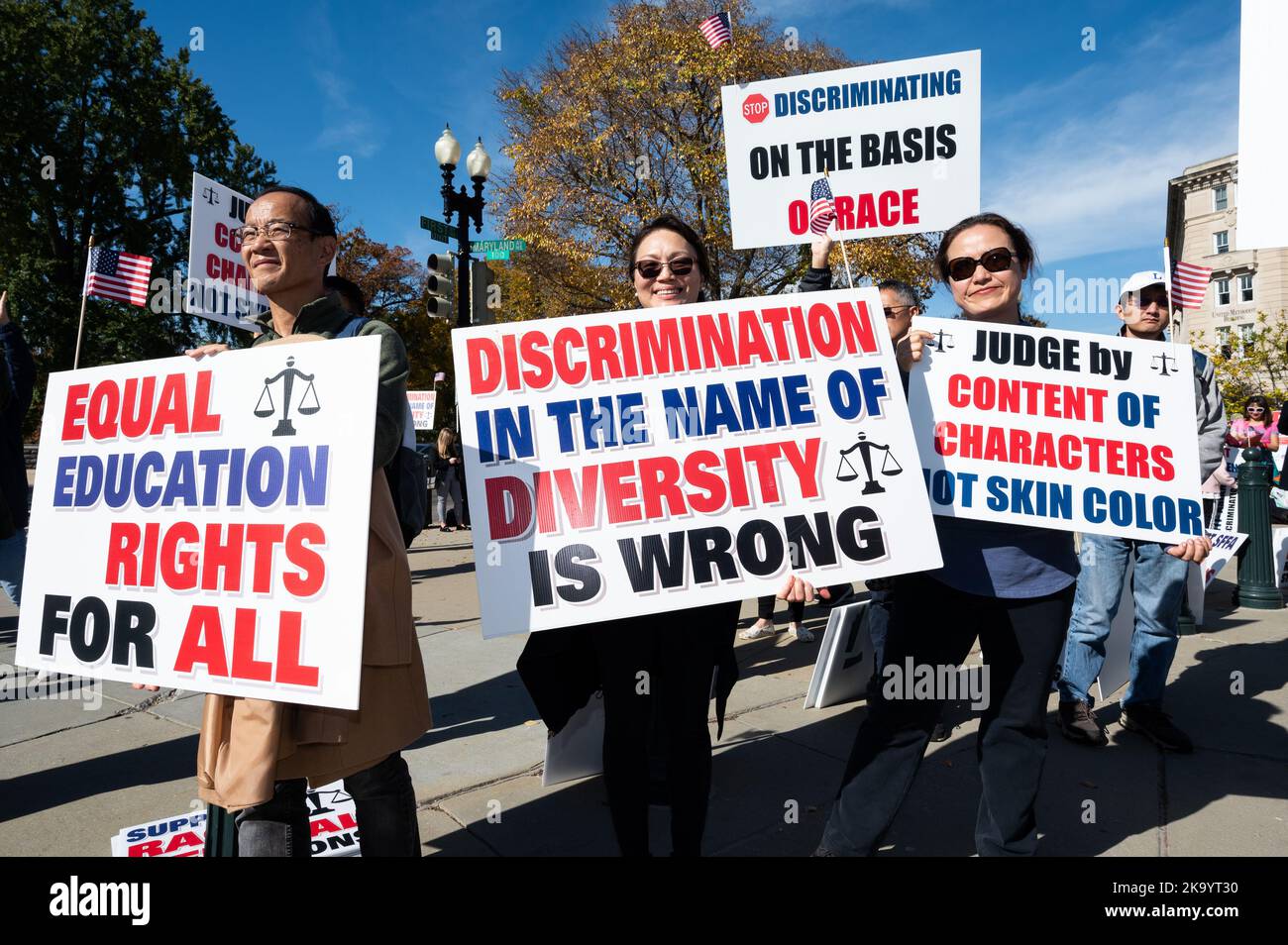 "People with signs saying "Equal education rights for all" and ...