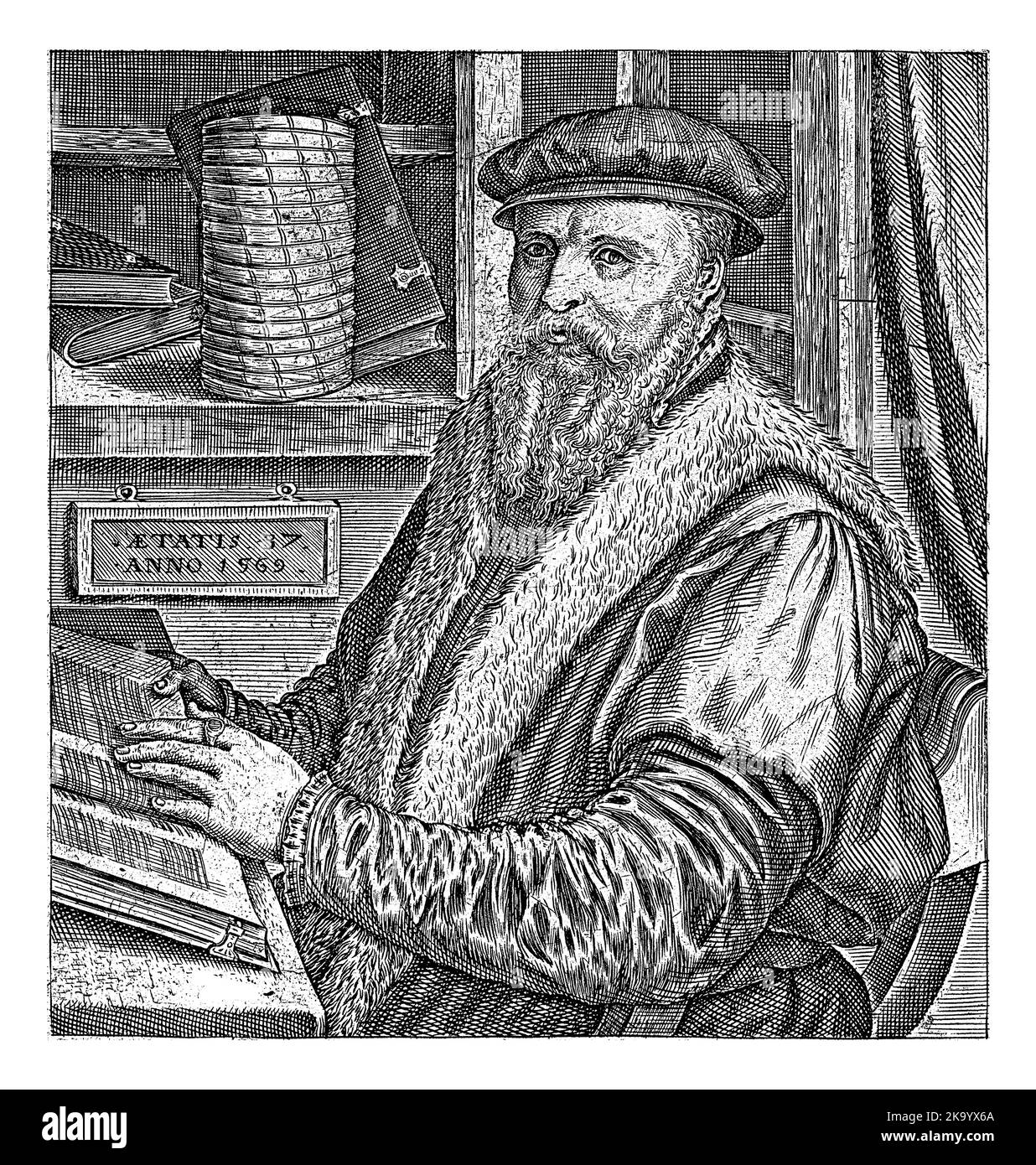 Adam Maeus sitting at a table, his hands on an open book. In the bottom ...