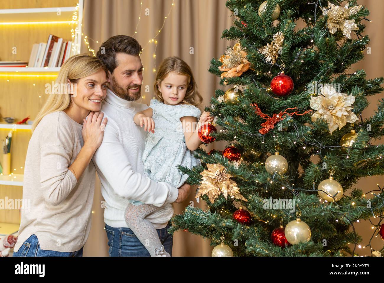 Christmas and new year family decorate tree, man woman and child ...