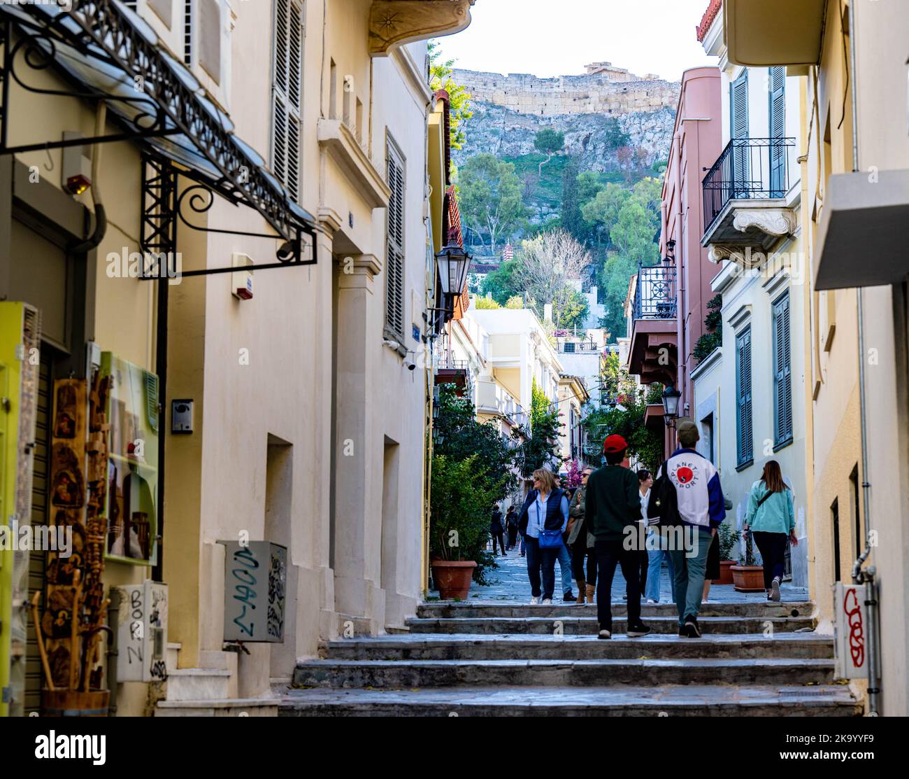 Greek streets with on the background the Parthenon on the Acropolis of ...