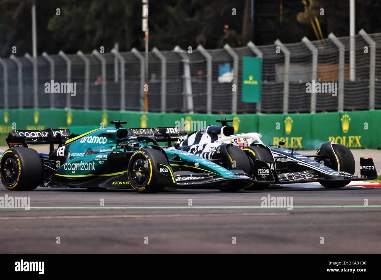 Lance Stroll (CDN) Aston Martin F1 Team AMR22 and Pierre Gasly (FRA) AlphaTauri AT03 battle for ...