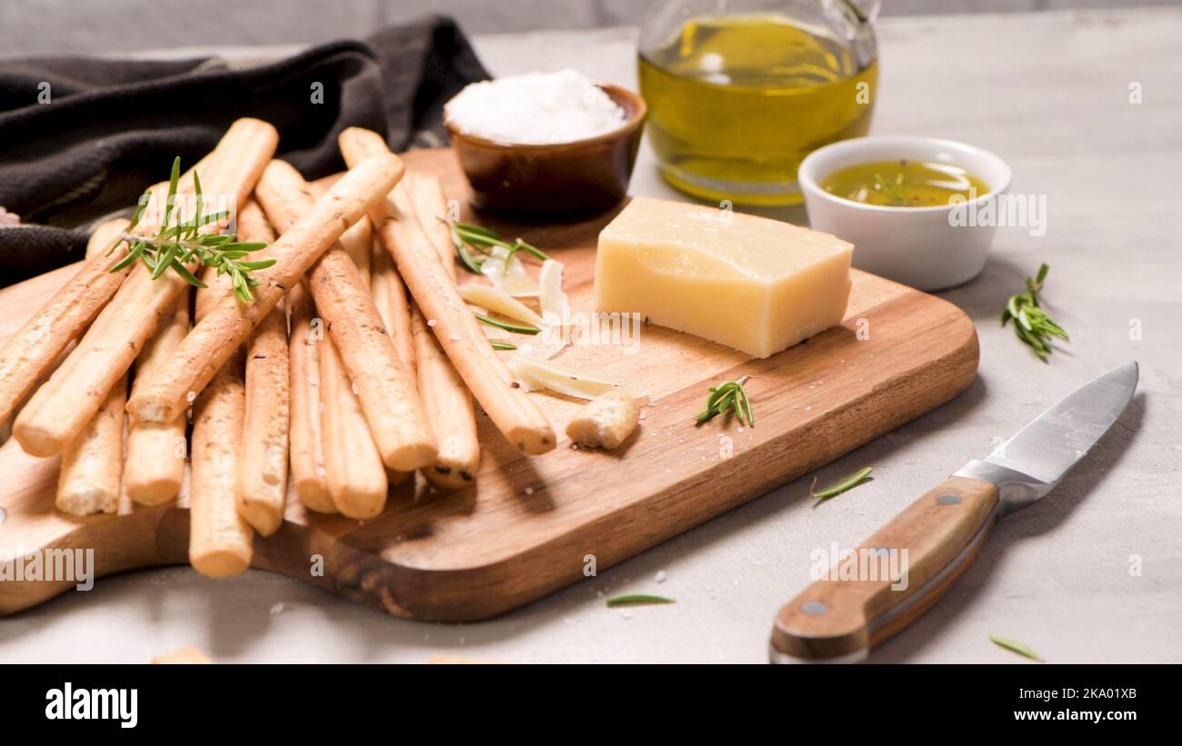 Fresh baked homemade grissini bread sticks in vintage metal grid box ...