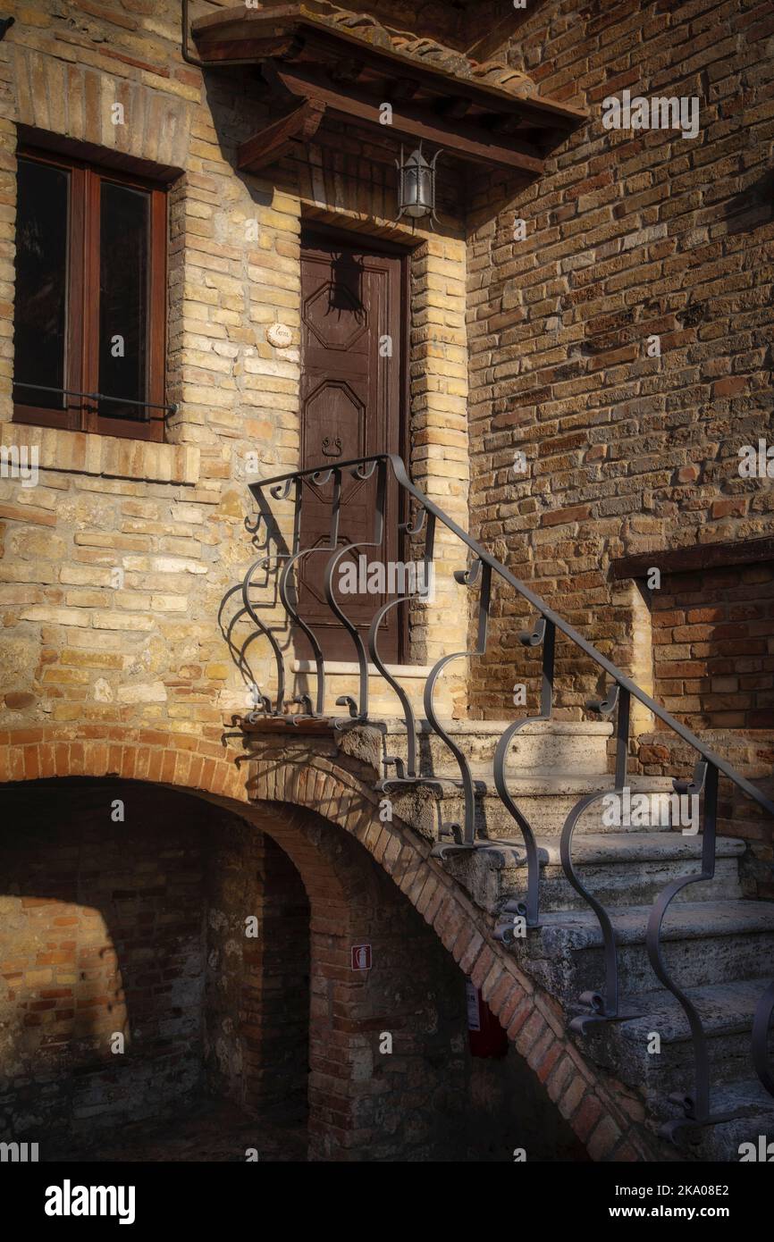 The elegant entryway to a villa in San Gimignano, Italy Stock Photo - Alamy