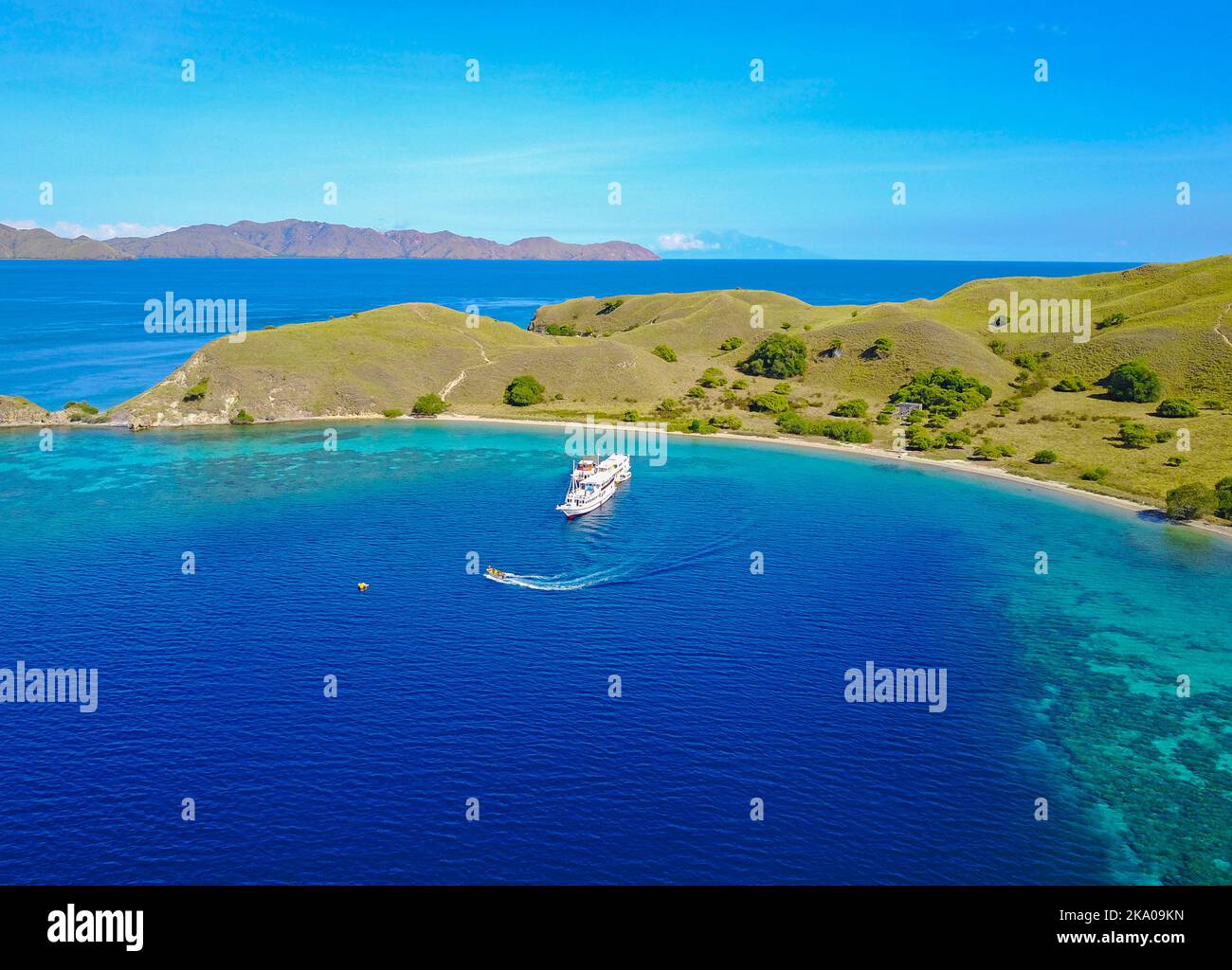 Tourist boat passing over Gili Lawa Island, aerial view Stock Photo - Alamy