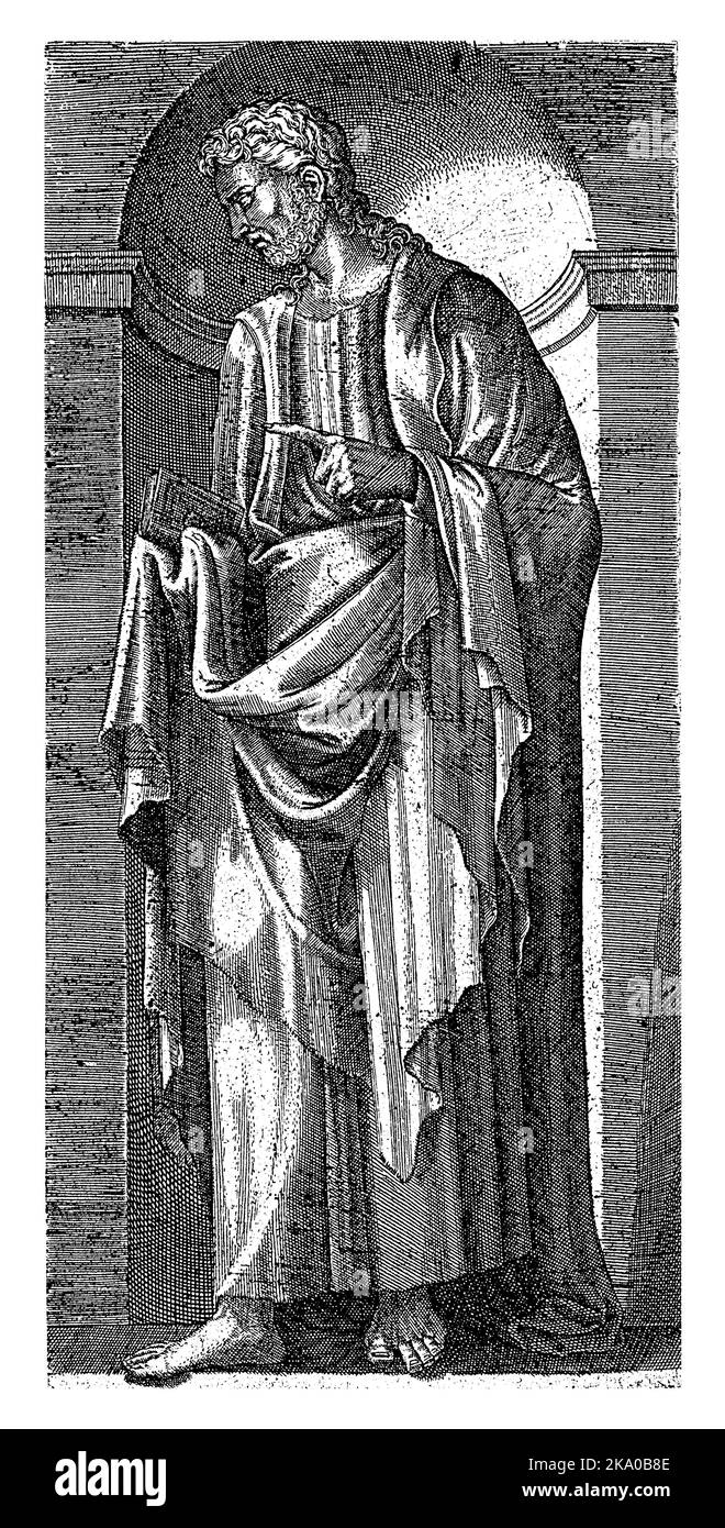 The apostle Thomas standing in a niche with a book in one hand and ...